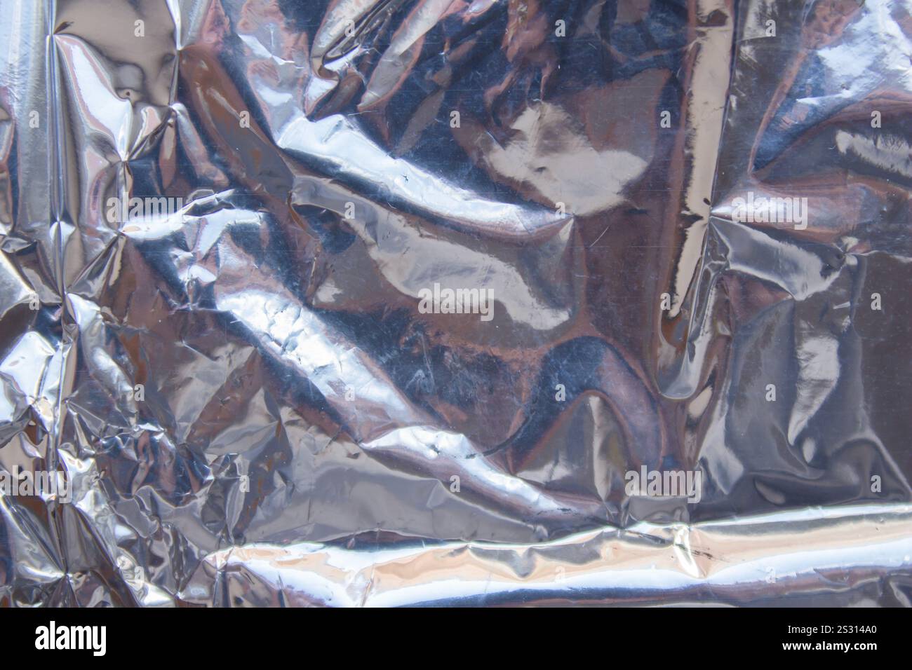 Crumpled reflective shiny gift wrapping material texture background ...