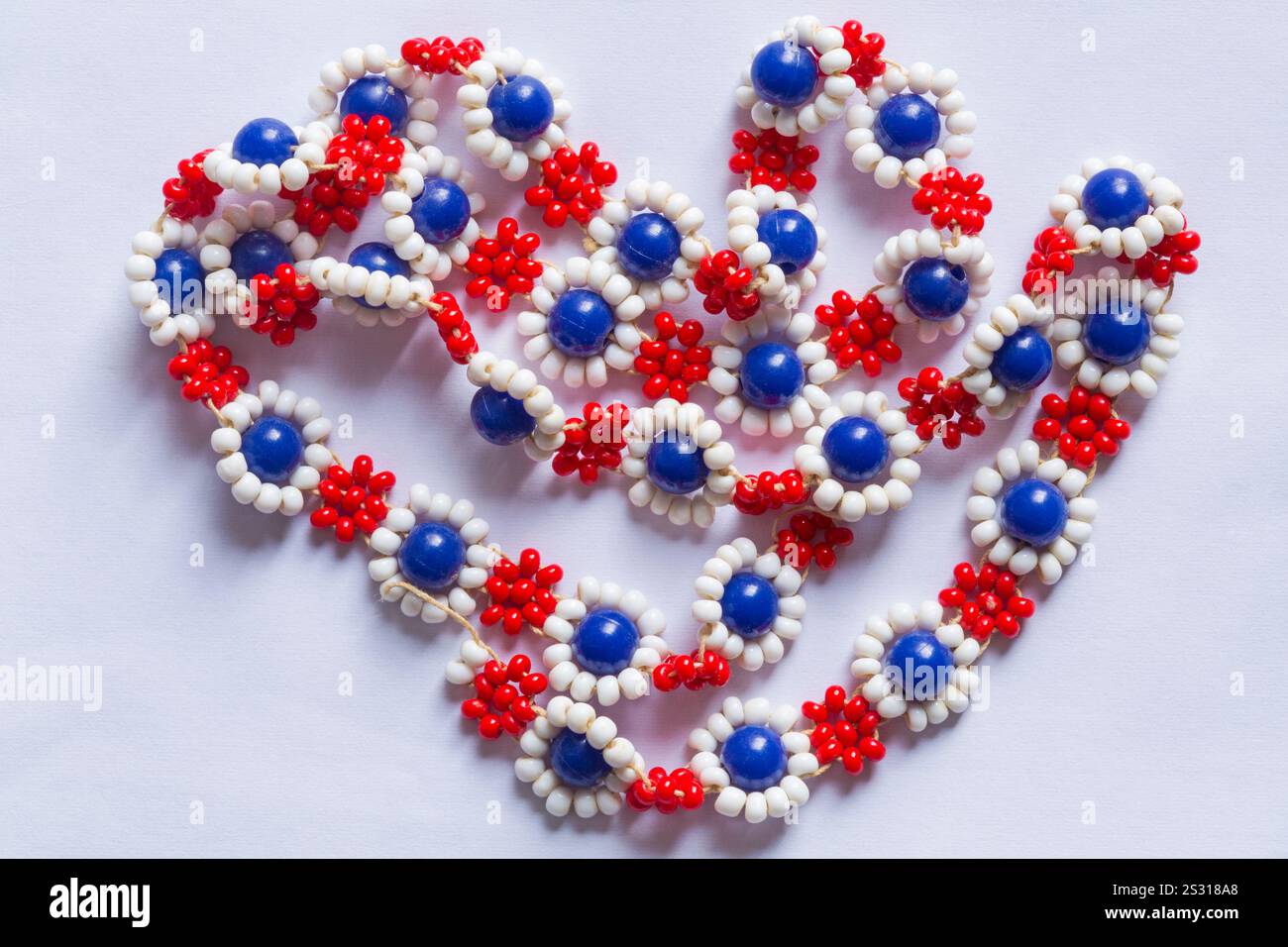 African beads beaded necklace in red white and blue isolated on white ...