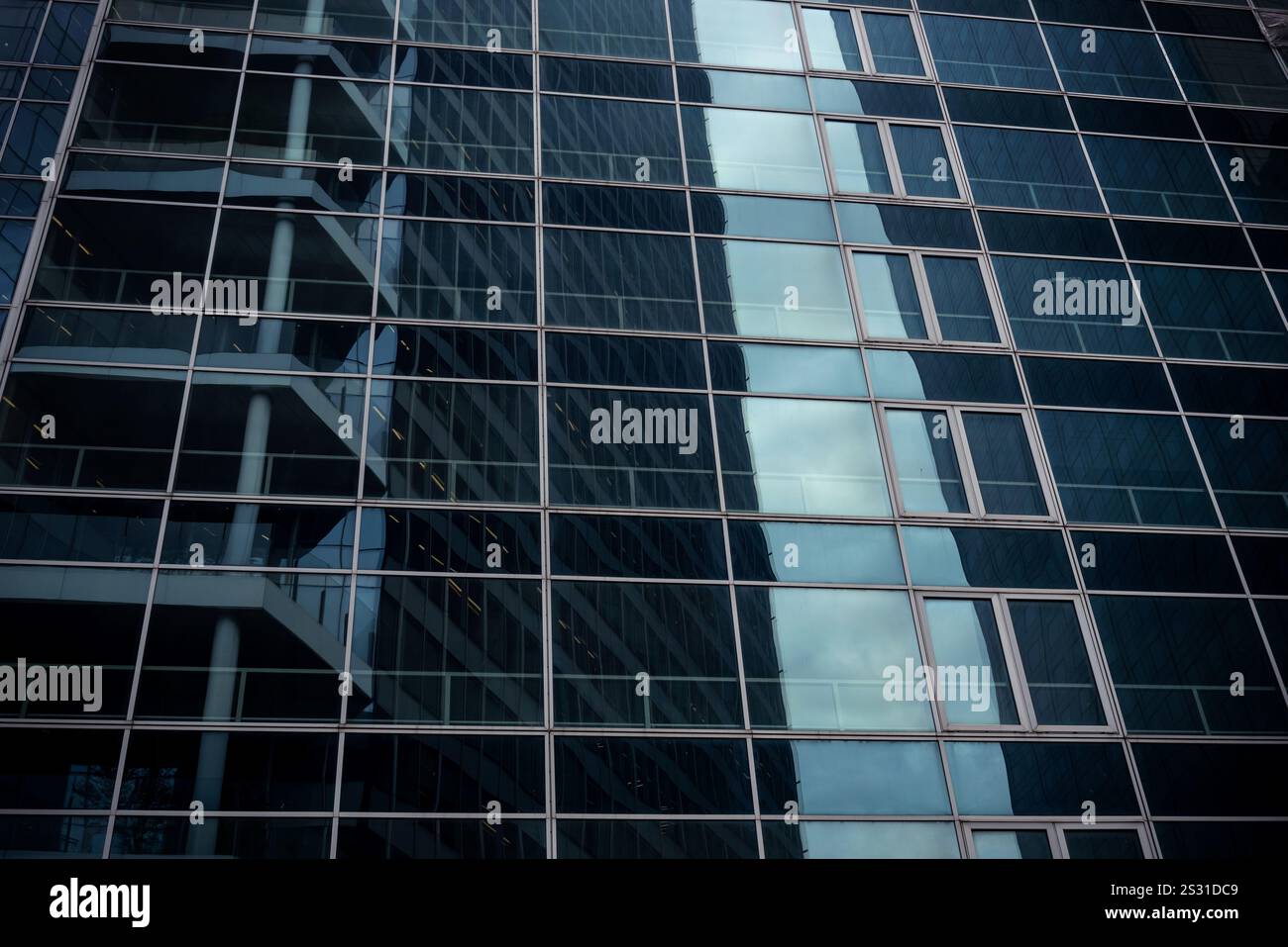 Abstract architecture of a glass fronted office building in a Paris ...