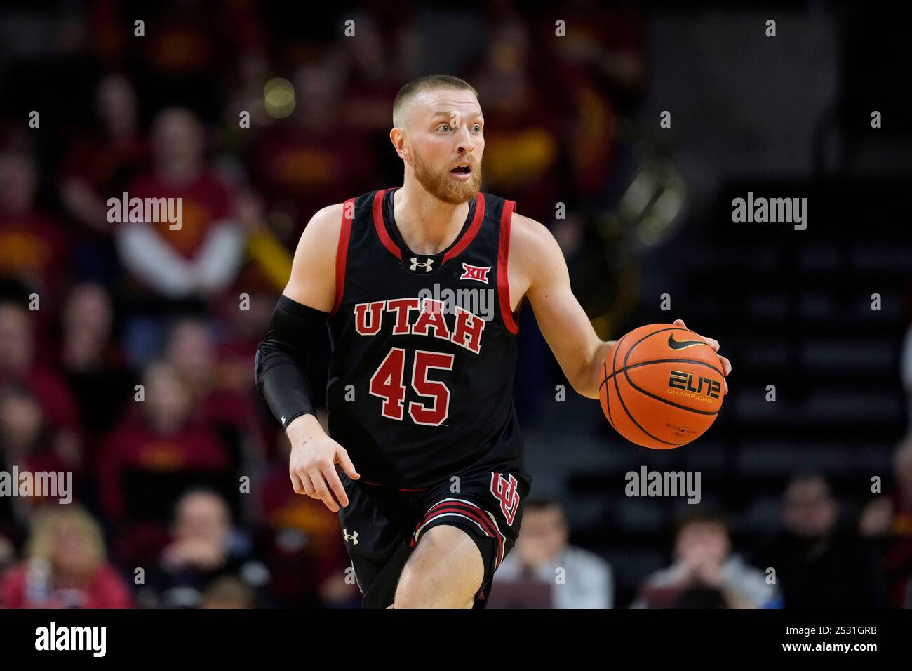 Utah guard Mason Madsen drives up court during the first half of an ...