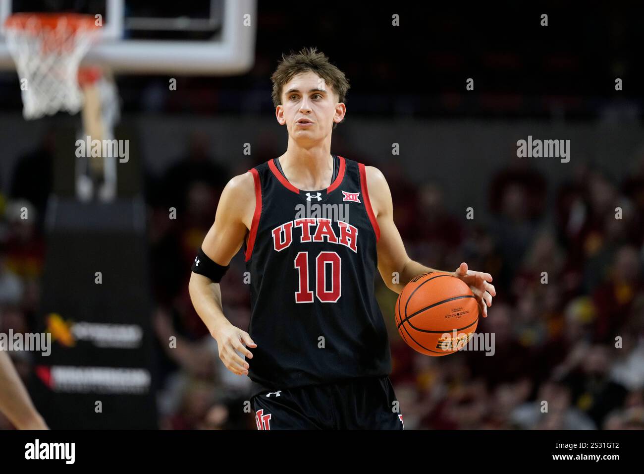 Utah forward Jake Wahlin drives up court during the first half of an ...