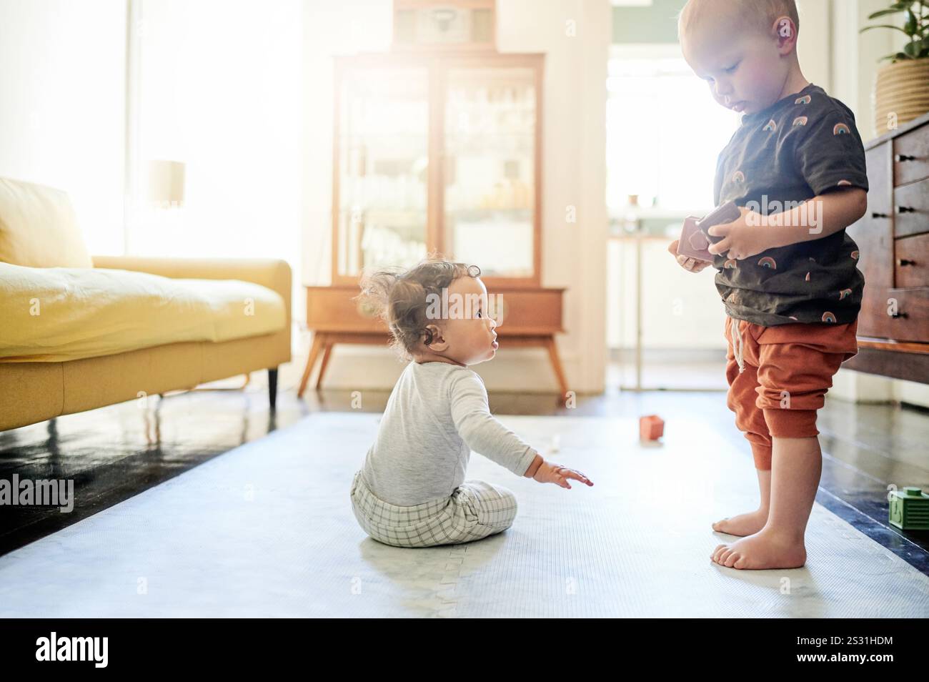 Baby, living room and children play with toys for bonding, quality time ...