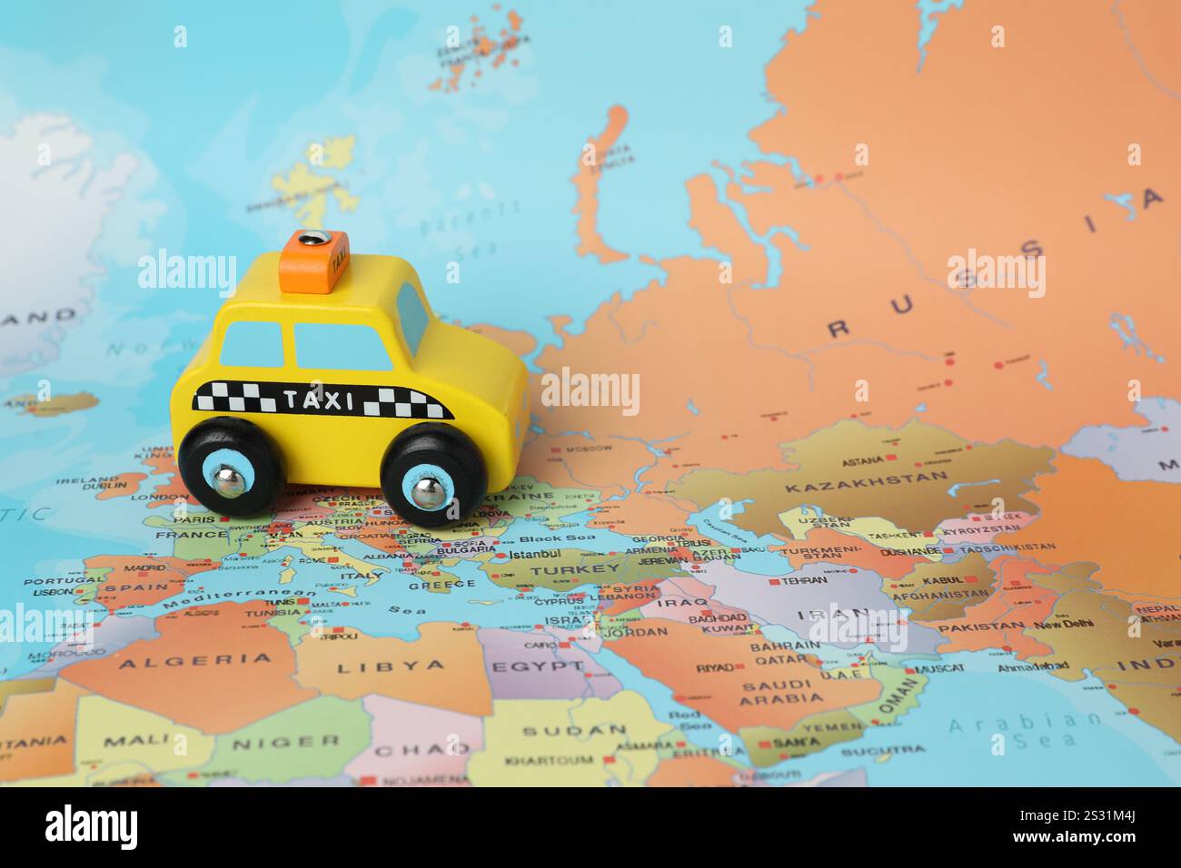 Yellow taxi car on world map. Road trip Stock Photo - Alamy