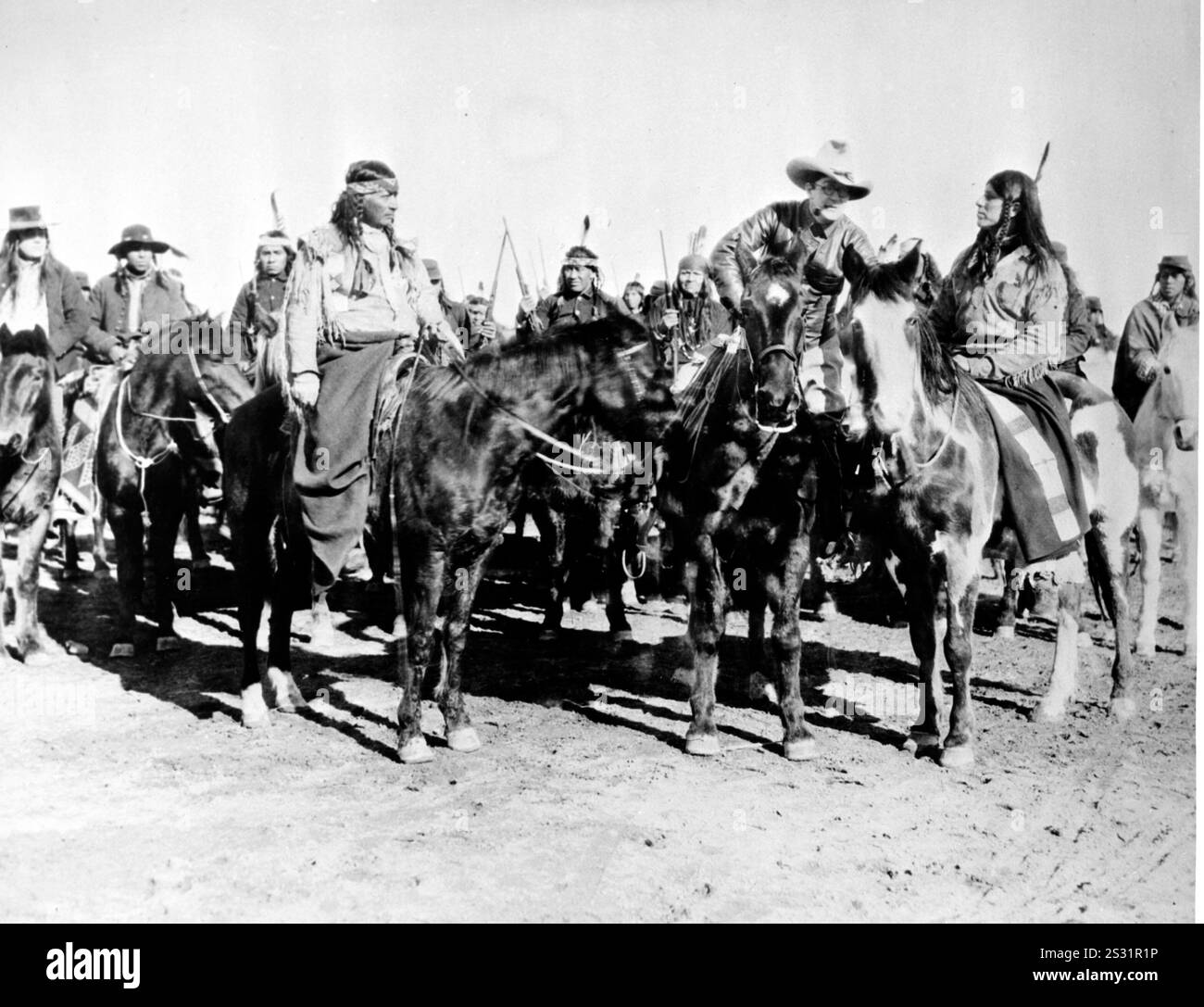 THE IRON HORSE DIRECTOR JOHN FORD WITH HAT AND PIPE TALKING TO IRON ...