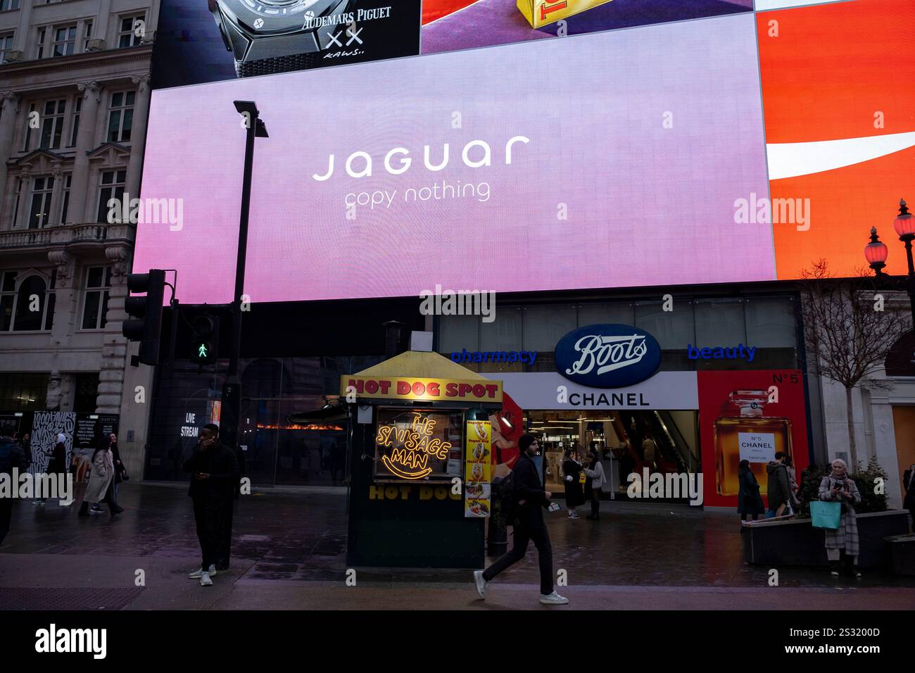 Digital advertising screens at Piccadilly Circus show an advert for the ...