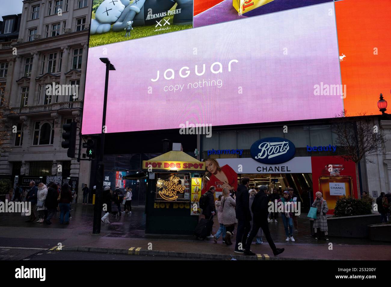 Digital advertising screens at Piccadilly Circus show an advert for the ...