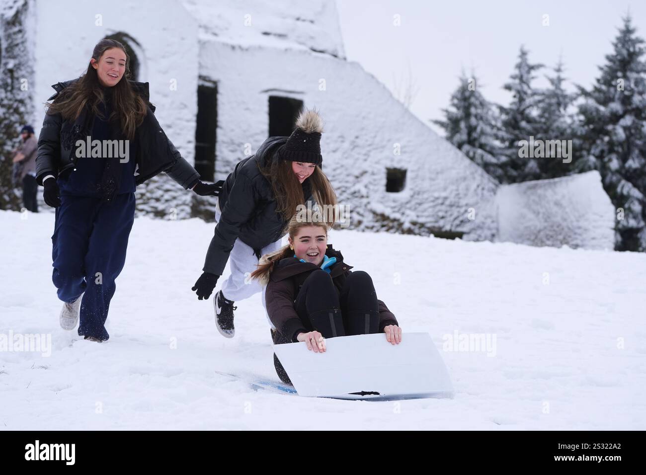 Nessa Wardick, from Templeogue, gets a push from her friends Faye ...