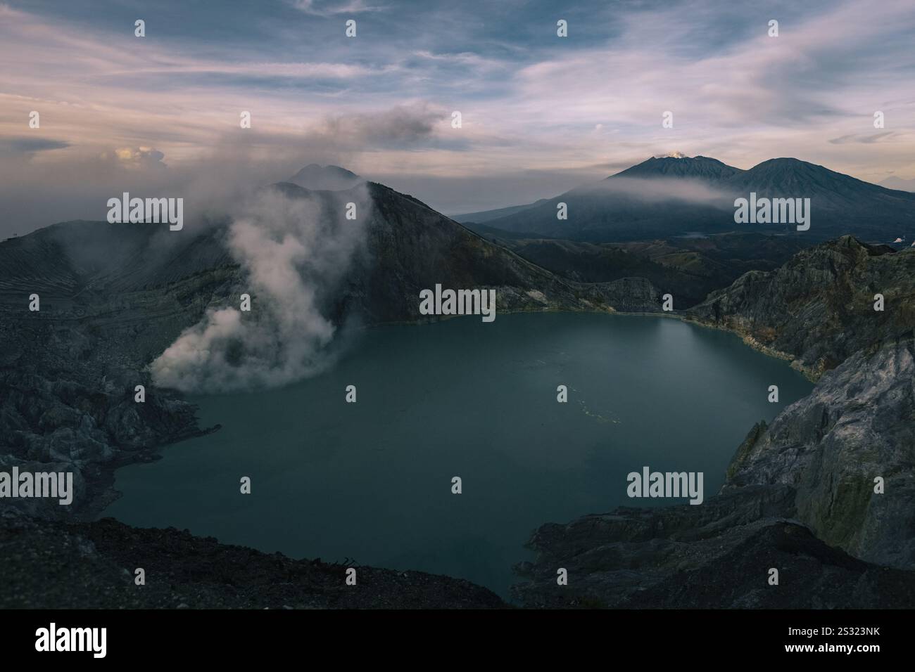 Sulfur smoke rising from Ijen crater over acid lake in Java island ...