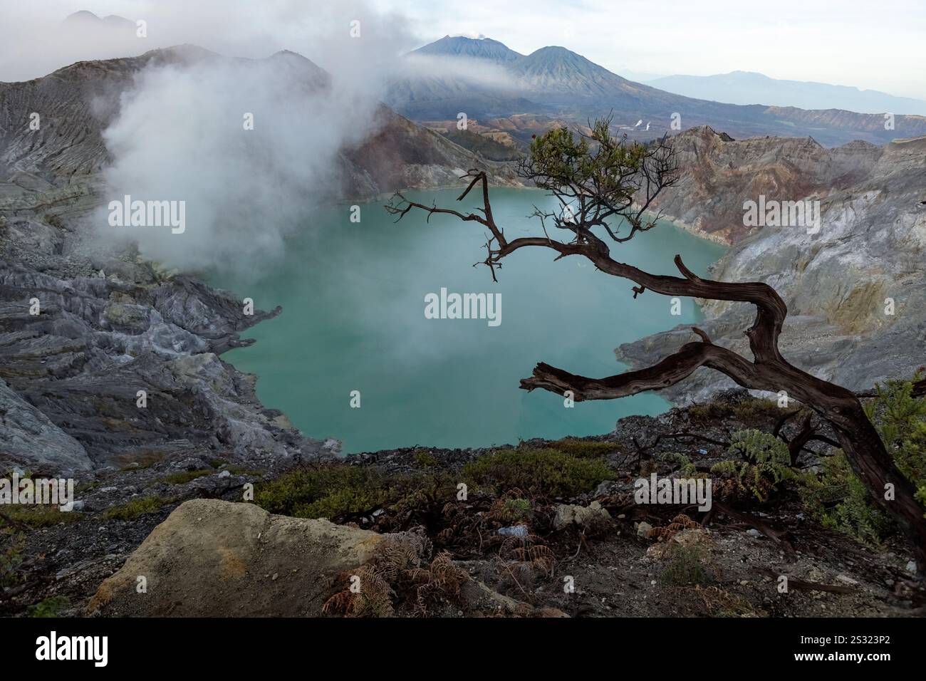 Sulfur smoke rising from Ijen crater over acid lake in Java island ...