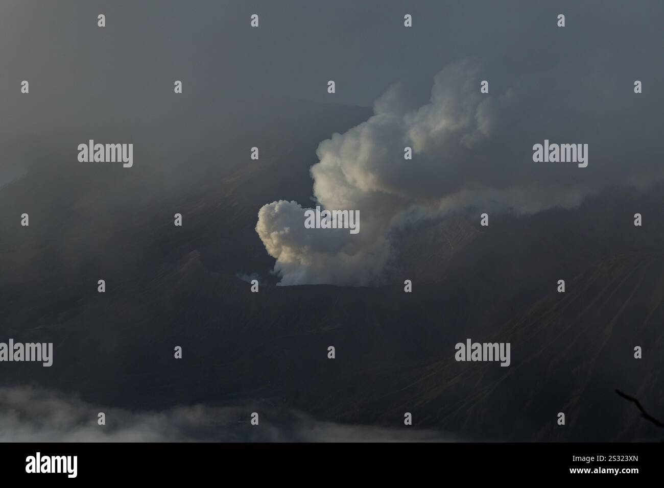 Smoke rising from Bromo volcano, Mount Bromo eruption Java island Indonesia Stock Photo - Alamy