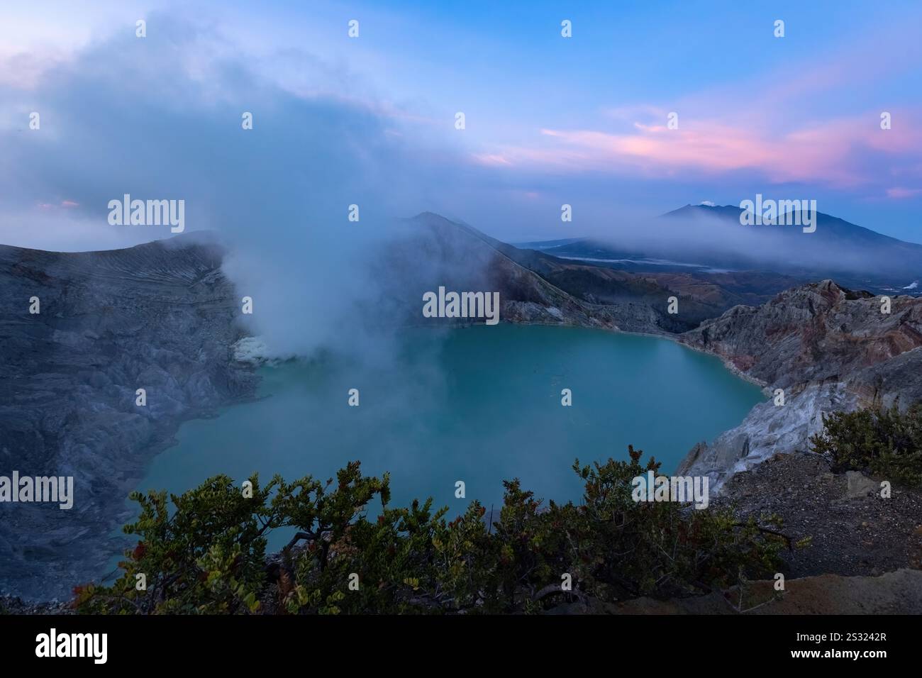 Sulfur smoke rising from Ijen crater over acid lake in Java island ...