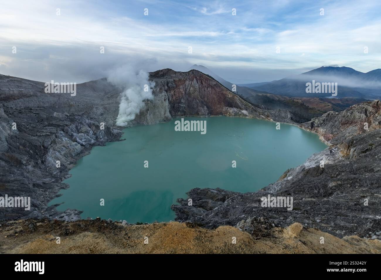 Sulfur smoke rising from Ijen crater over acid lake in Java island ...