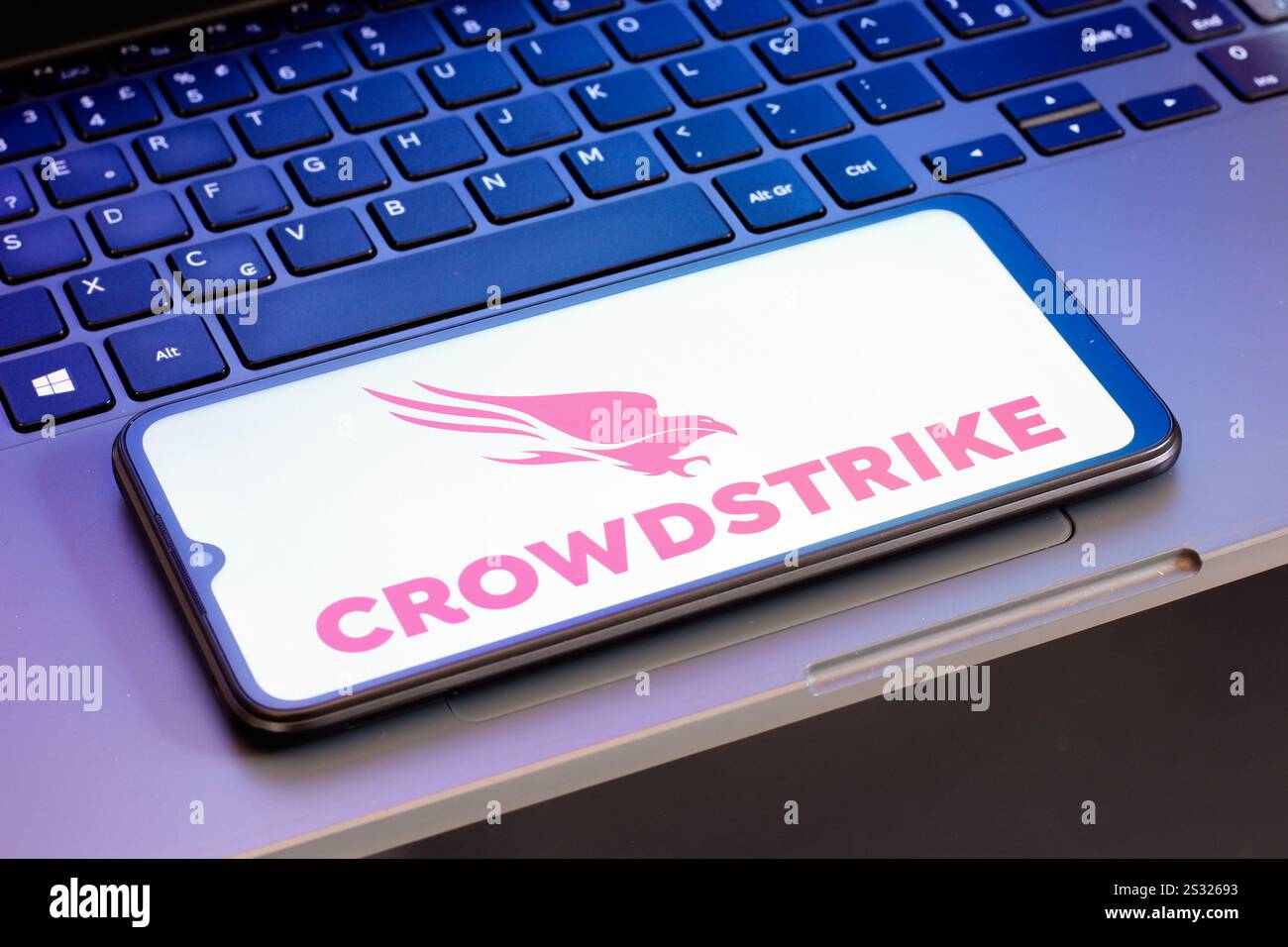 In this photo illustration, the CrowdStrike logo is seen displayed on a ...