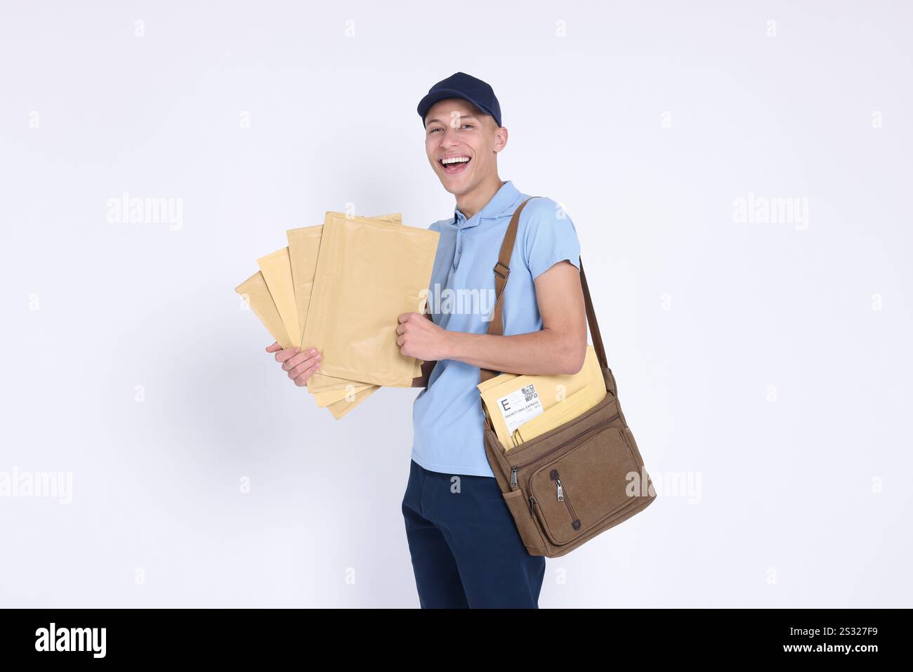 Happy postman with bag and envelopes on white background Stock Photo ...