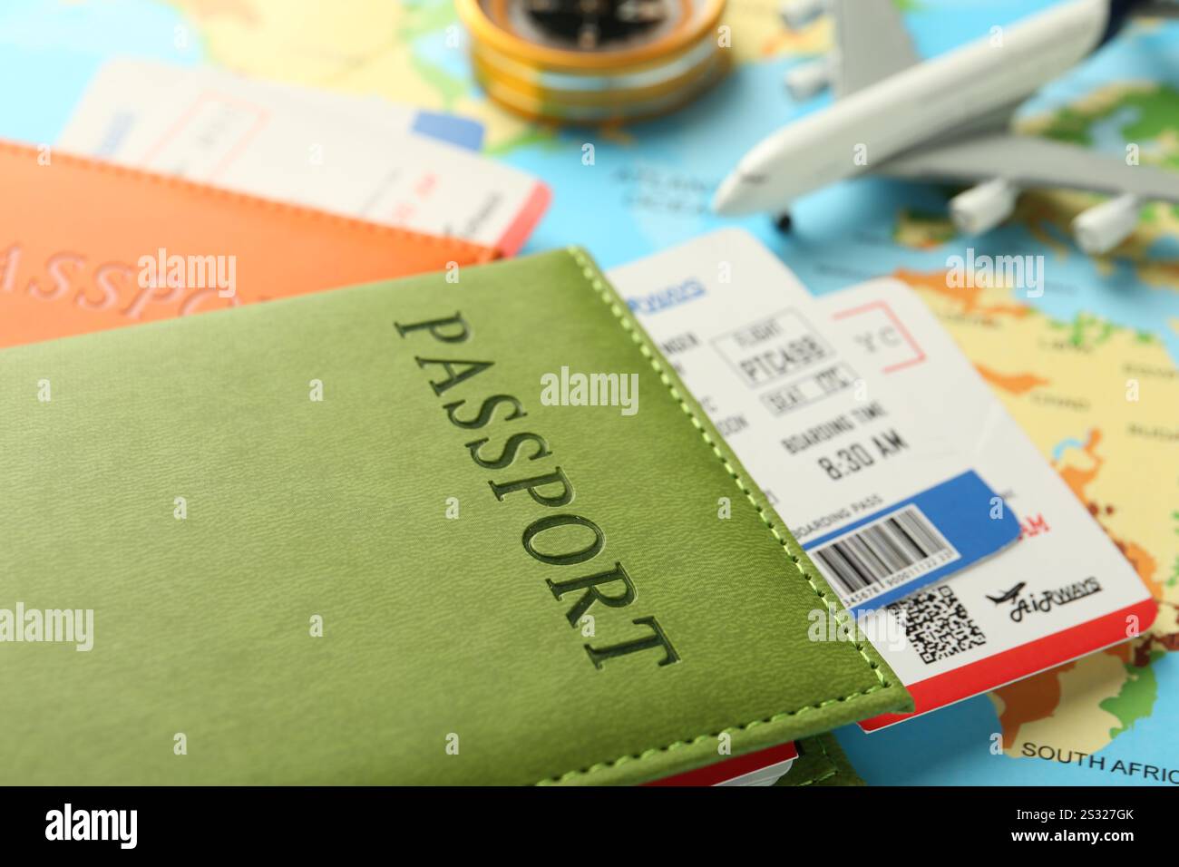 Passports with tickets and plane model on world map, closeup Stock ...