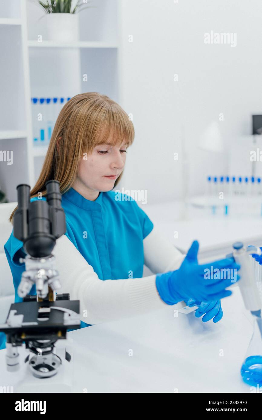 Woman research technician prepares analysis hi-res stock photography ...