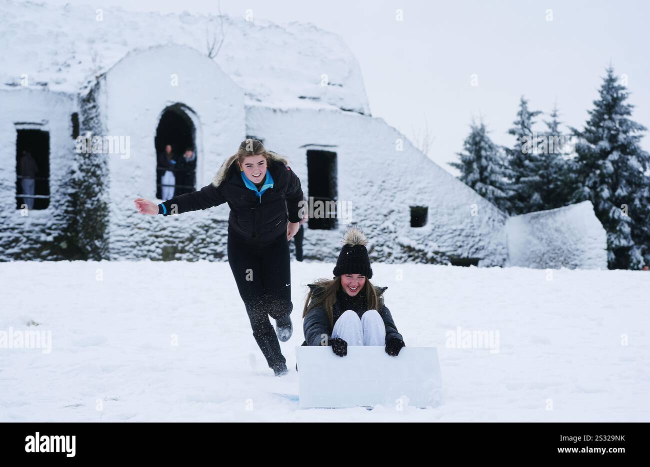 Faye Tierney, from Templeogue, gets a push from her friend Nessa ...