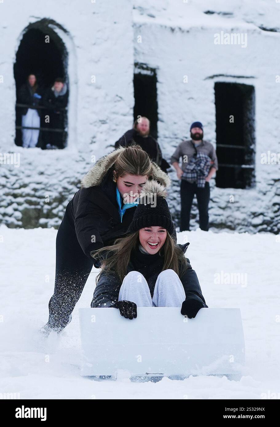 Faye Tierney, from Templeogue, gets a push from her friend Nessa ...