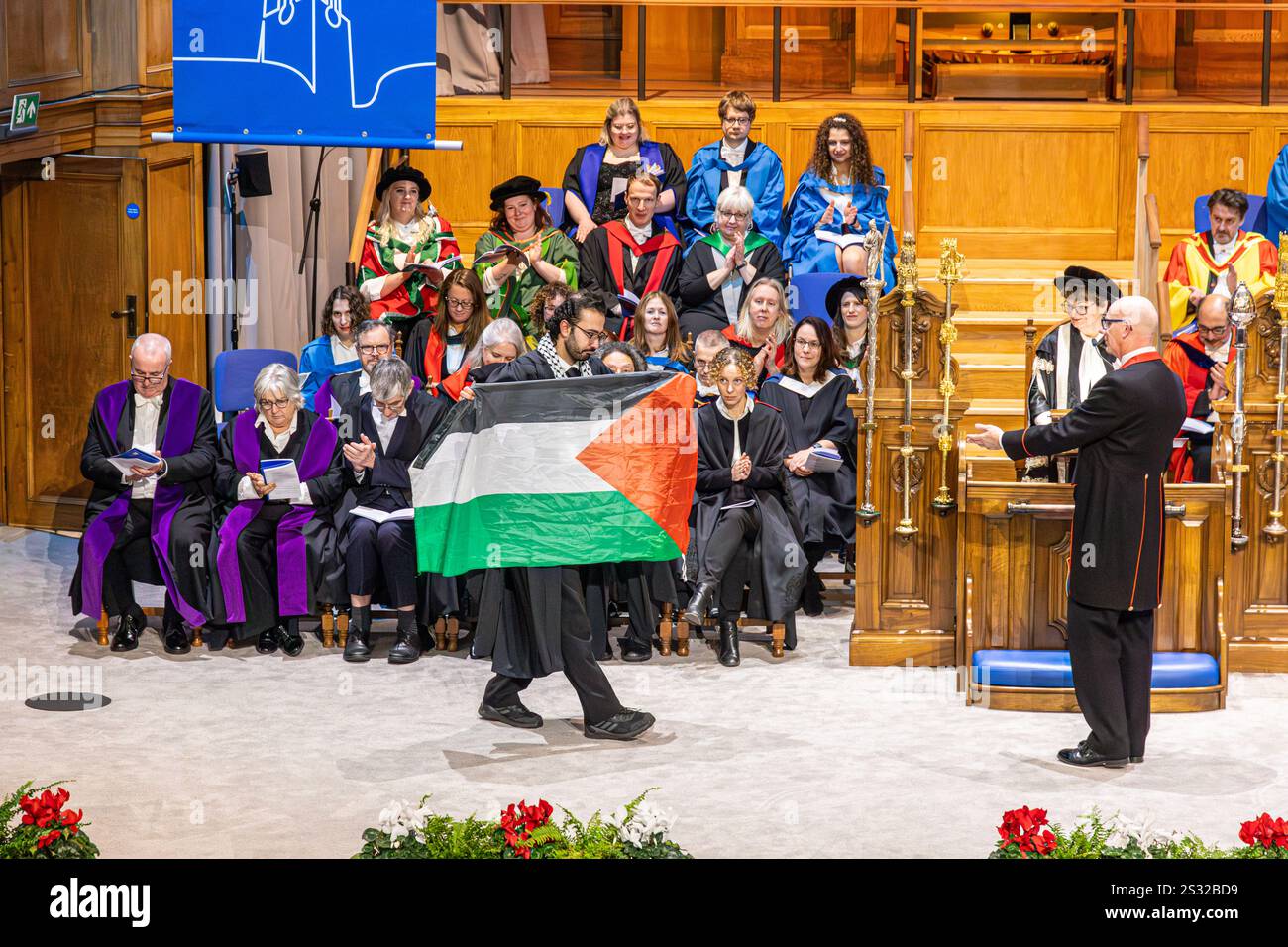 A graduating student making a political statement in support of ...