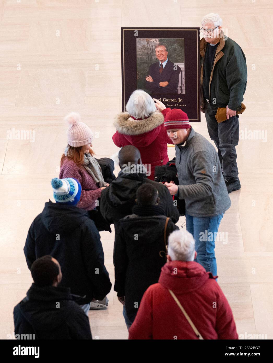 UNITED STATES - JANUARY 8: Visitors pose for photos by a photo of ...