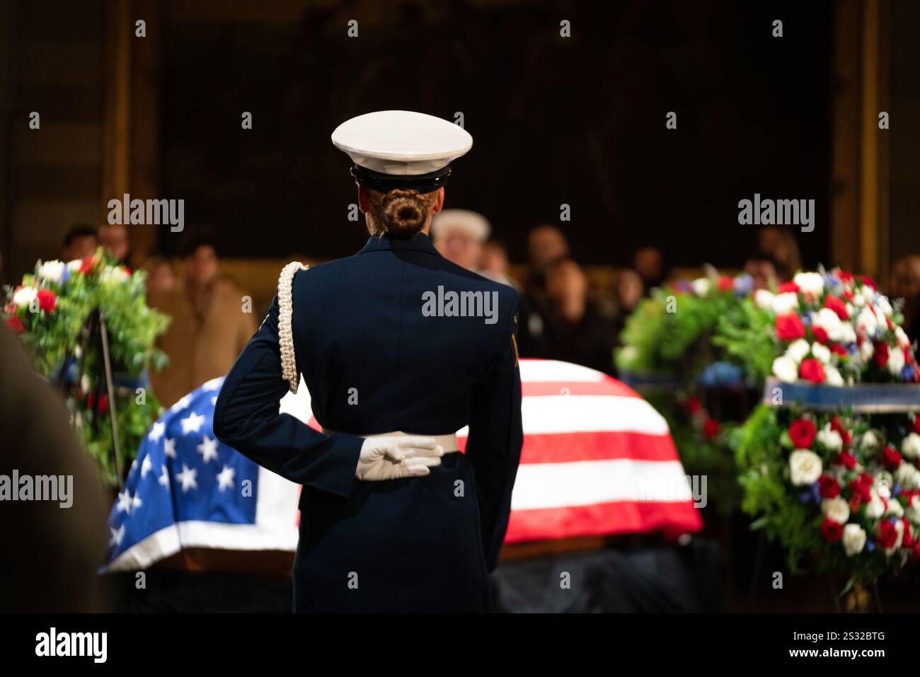 Washington, District Of Columbia, USA. 7th Jan, 2025. An honor guard stands watch over former ...