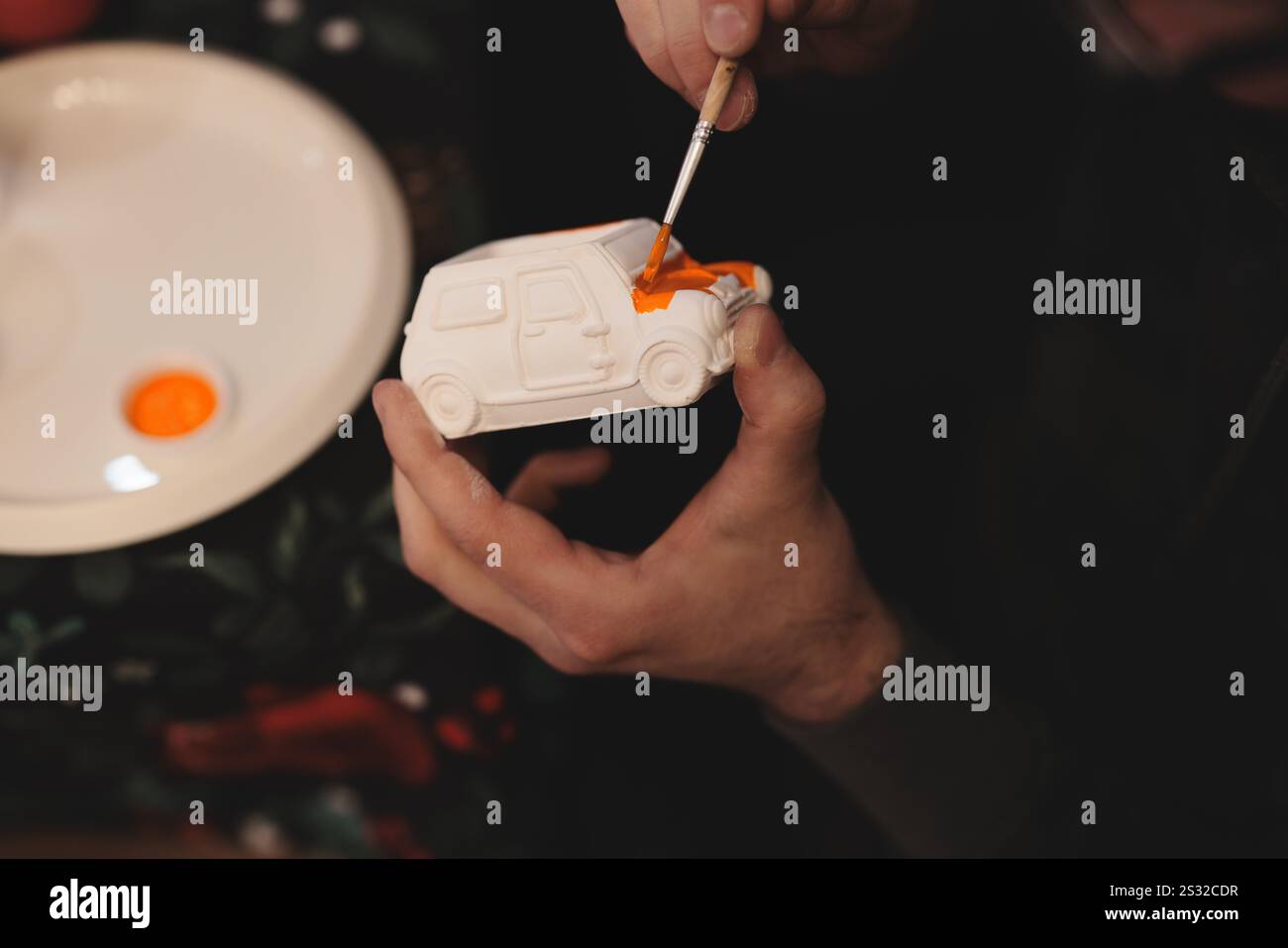 Crafting a colorful miniature vehicle with vibrant paint and artistic ...