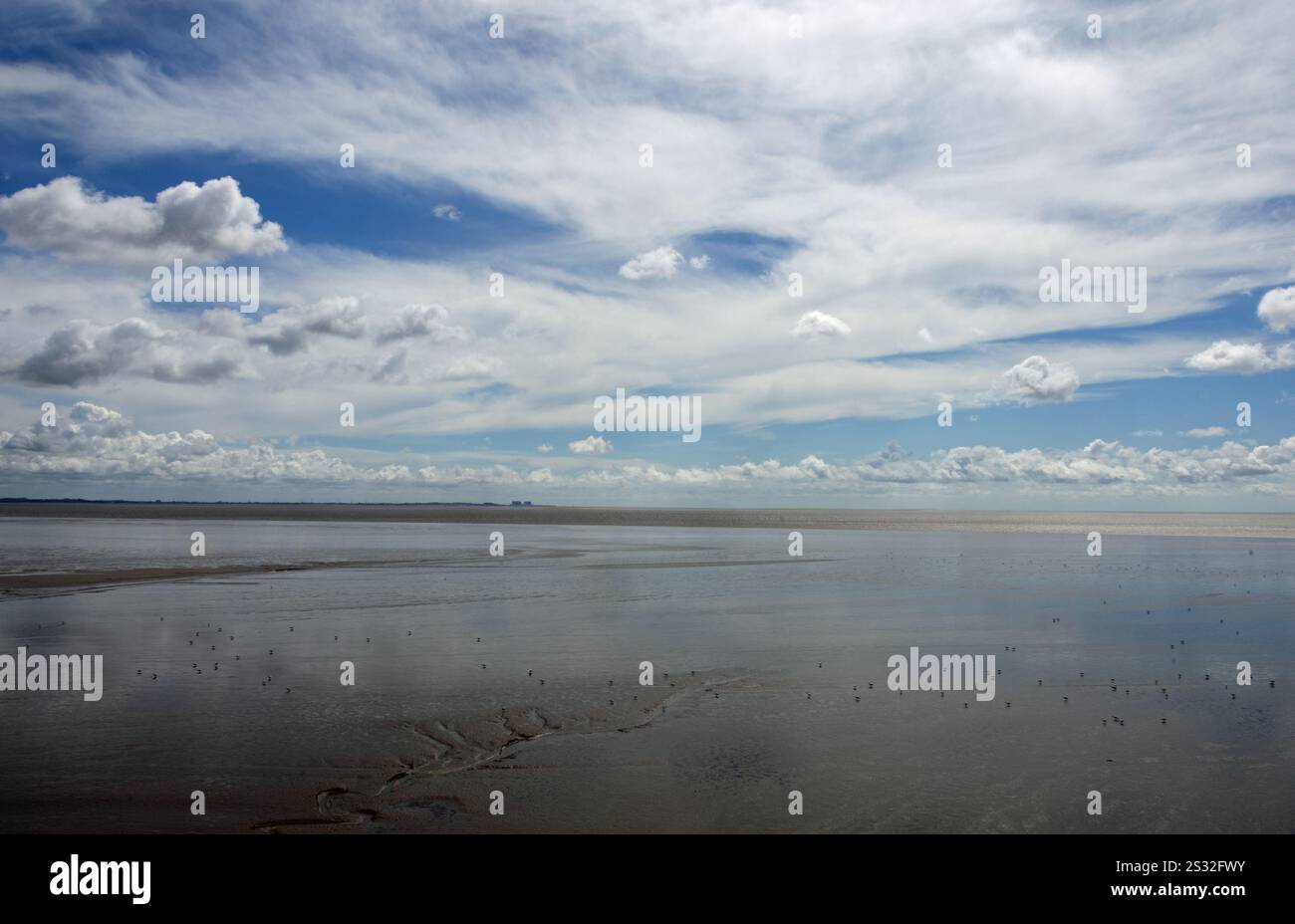 Mud flats and cloudscapes Morecambe Bay near Silverdale Lancashire ...