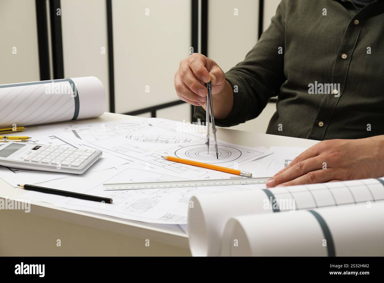 Engineer working with project, closeup. Different technical drawings on table Stock Photo - Alamy