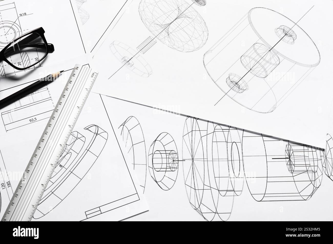Different engineering drawings, ruler, pencil and glasses, top view ...