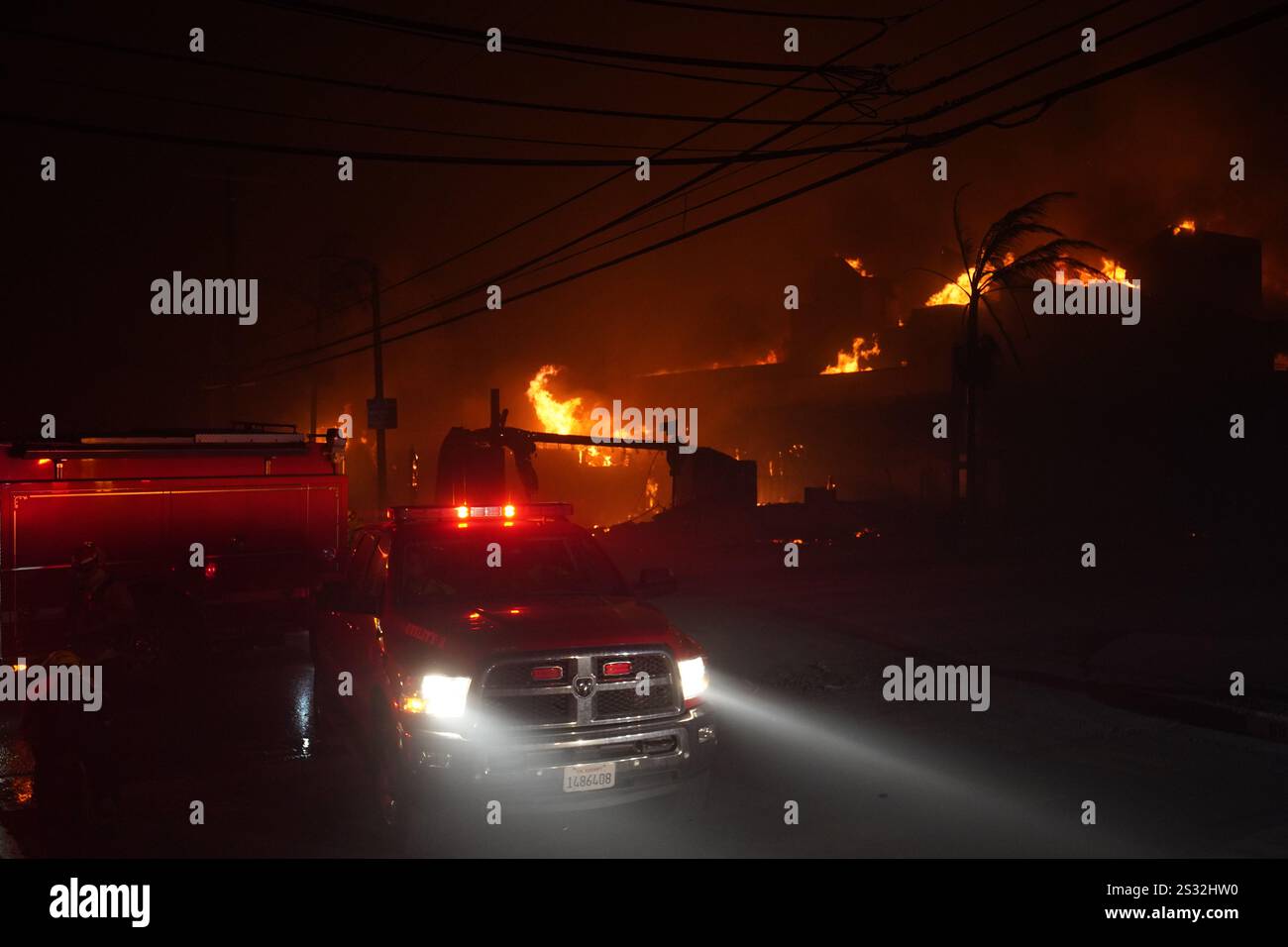 Fire trucks are seen at the scene. The wildfire in Pacific Palisades ...