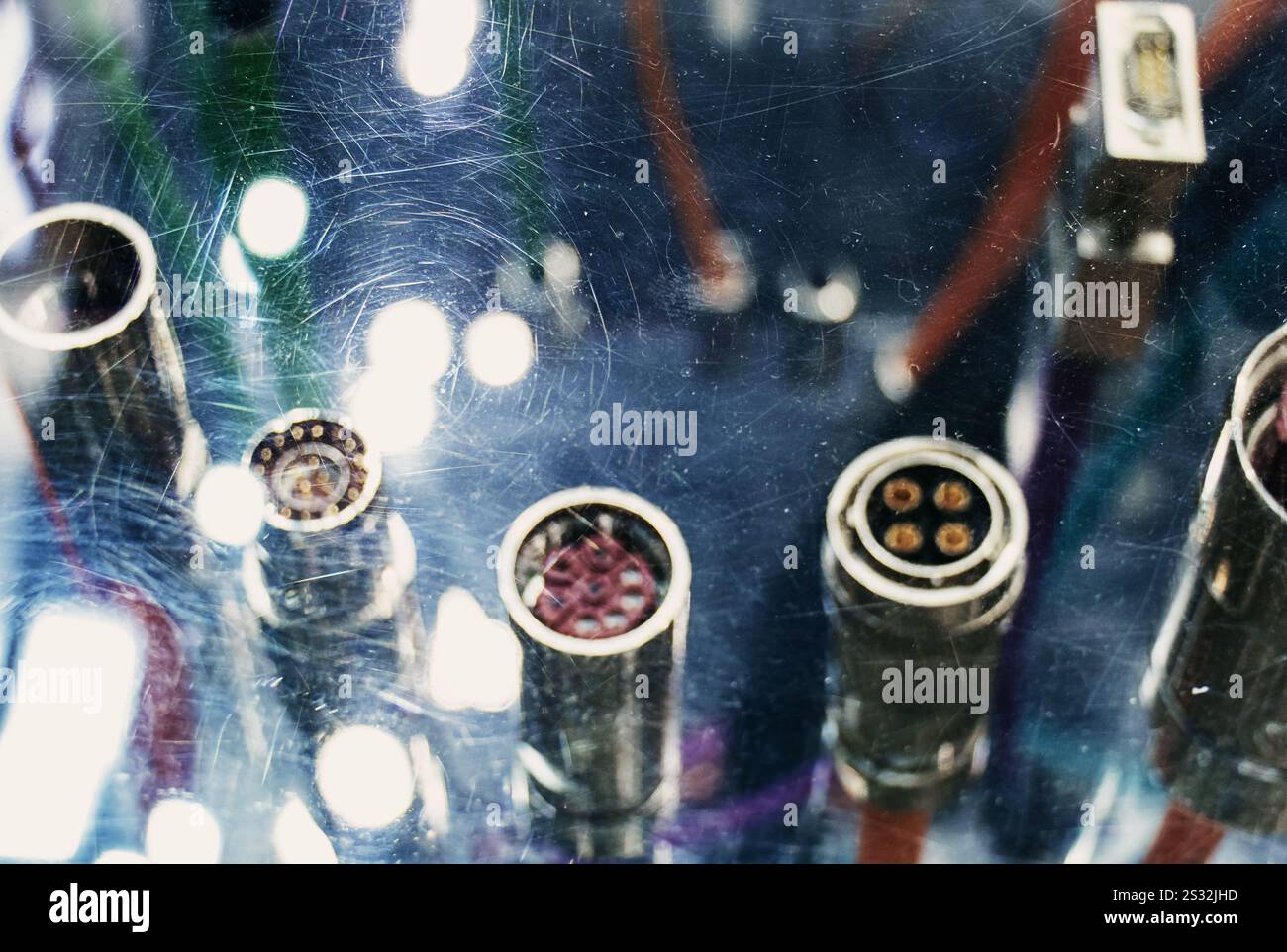 Blurred industrial background with cable connectors and scratches on ...