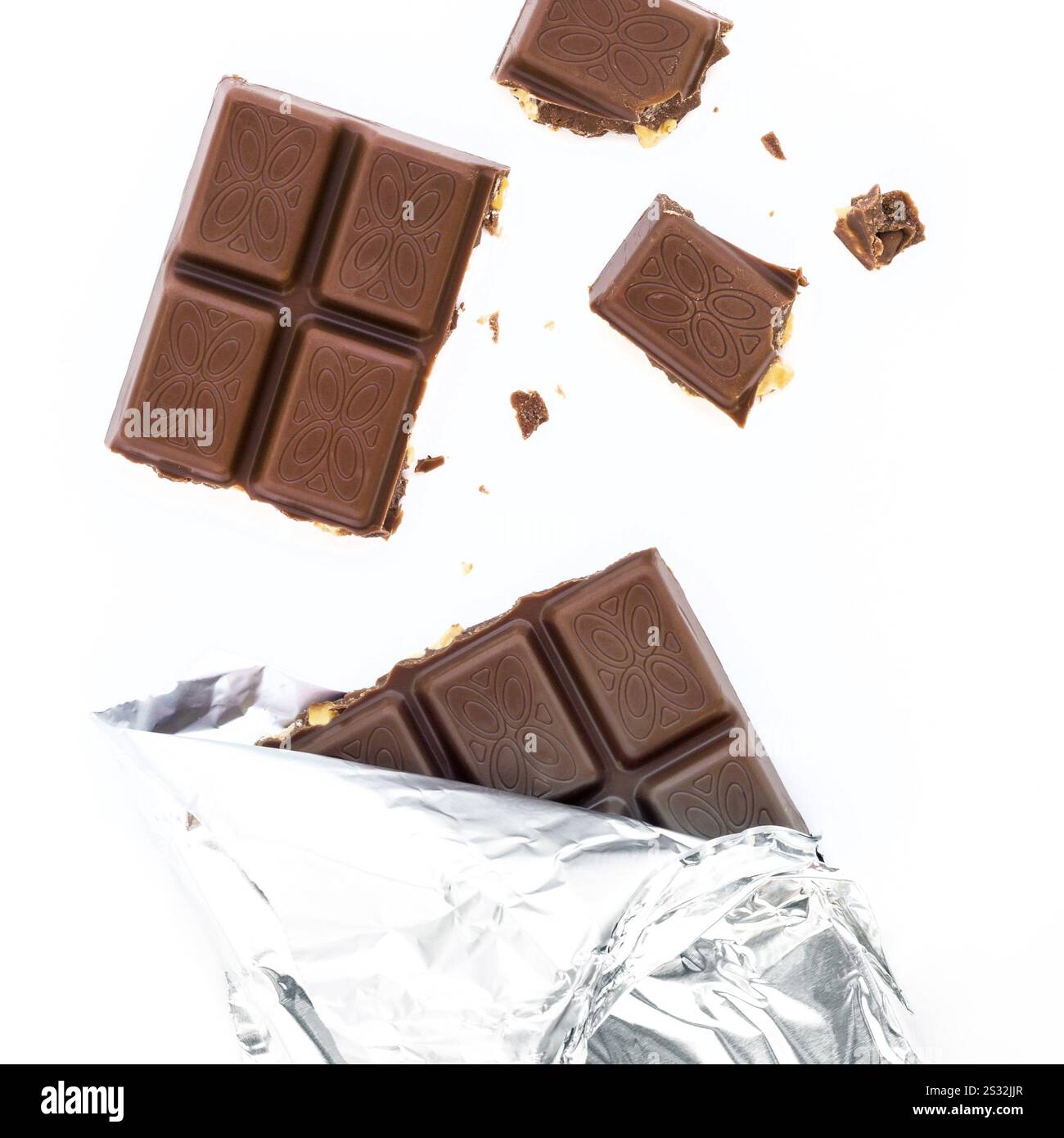 Chocolate bar. Bar of milk chocolate and almonds in a silver foil ...
