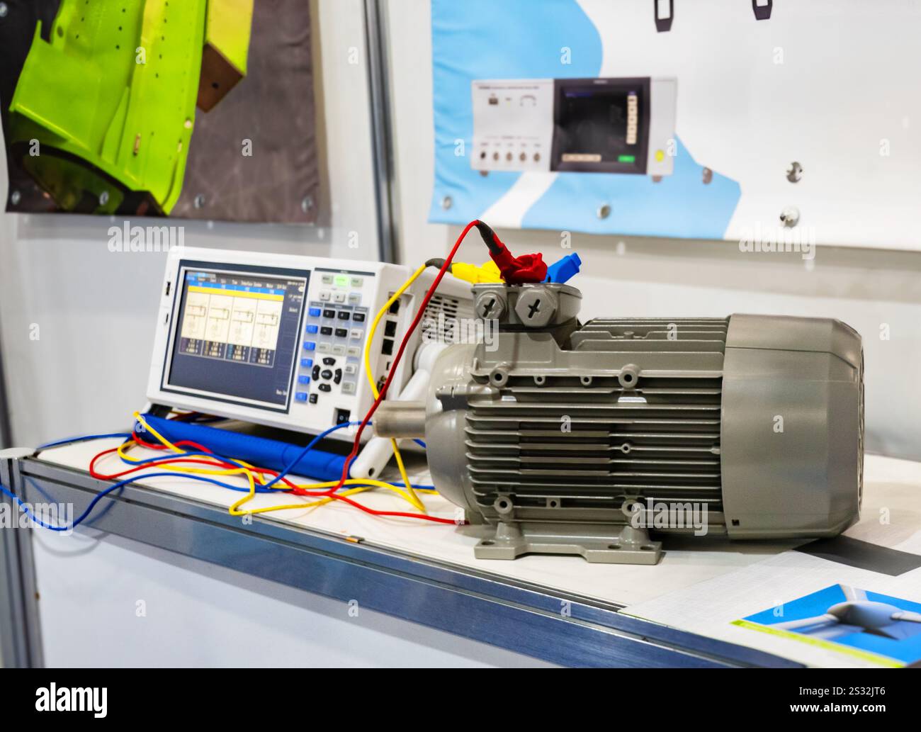Electric industrial motor connected to a power meter, energy analyzer ...