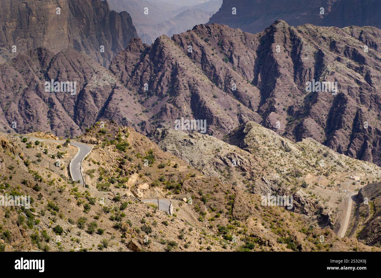 A mountain road through the green mountains called Jebel Akhdar of the ...