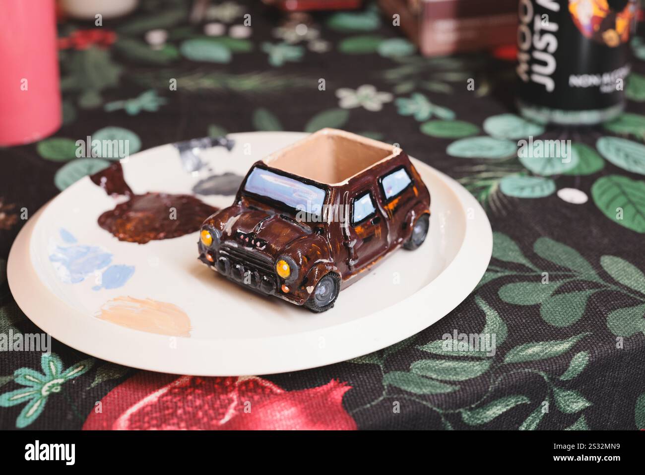 A Cute Chocolate Car Sculpture Displayed Beautifully on an Artistic ...