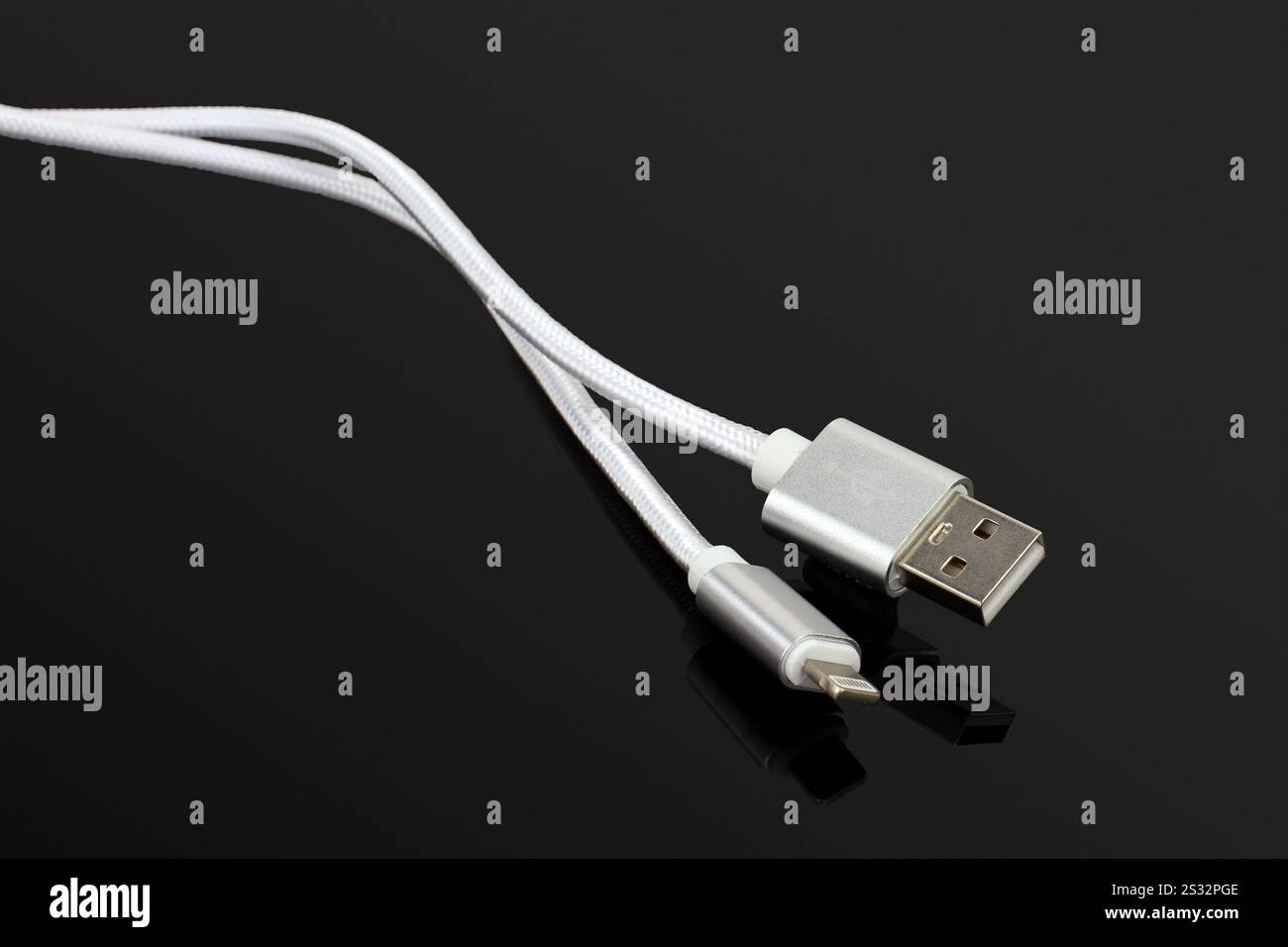 Silver USB Charging Cable on Black Background Stock Photo - Alamy