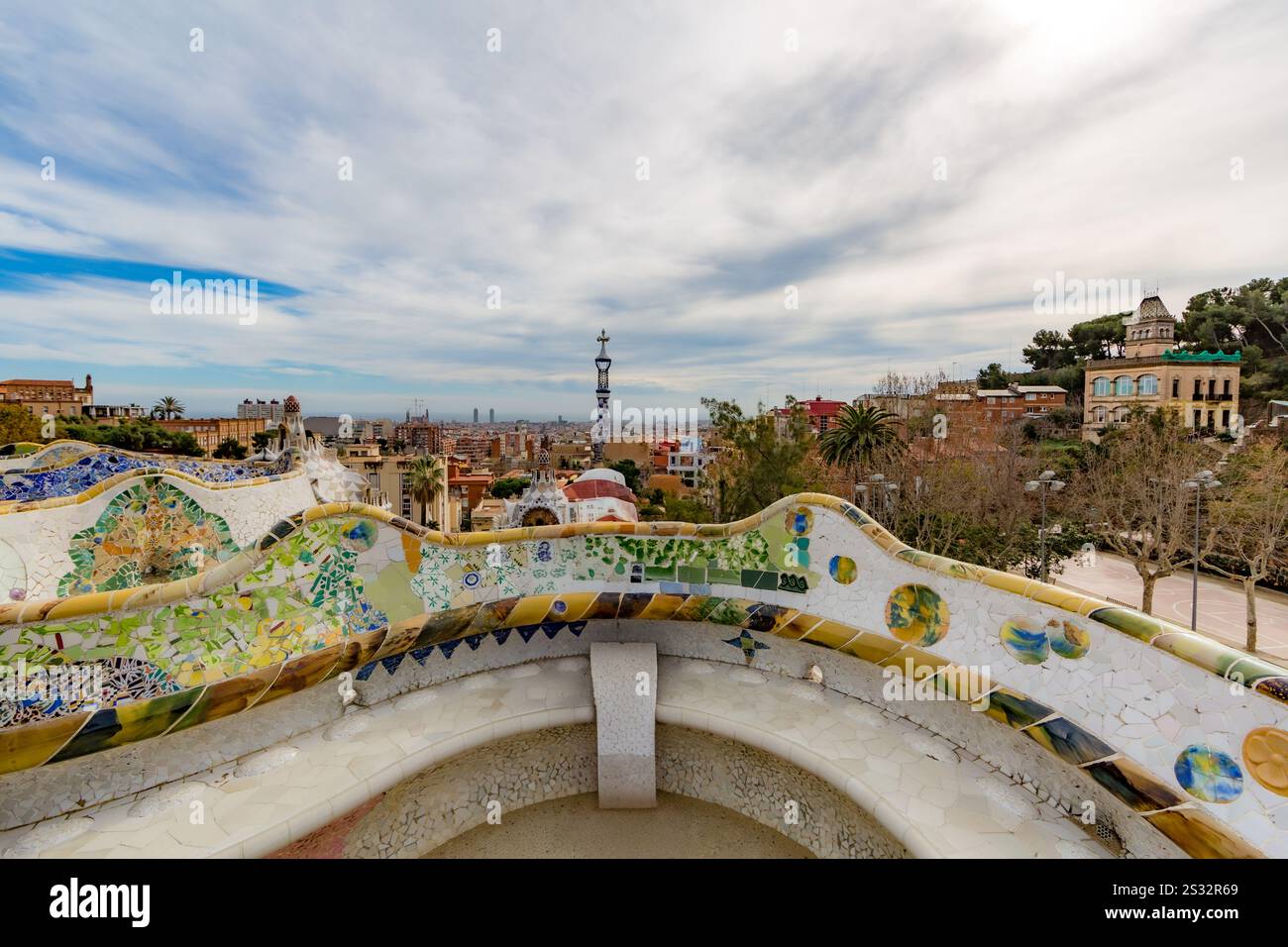Benches next to serpentine fence with mosaics in main square below ...