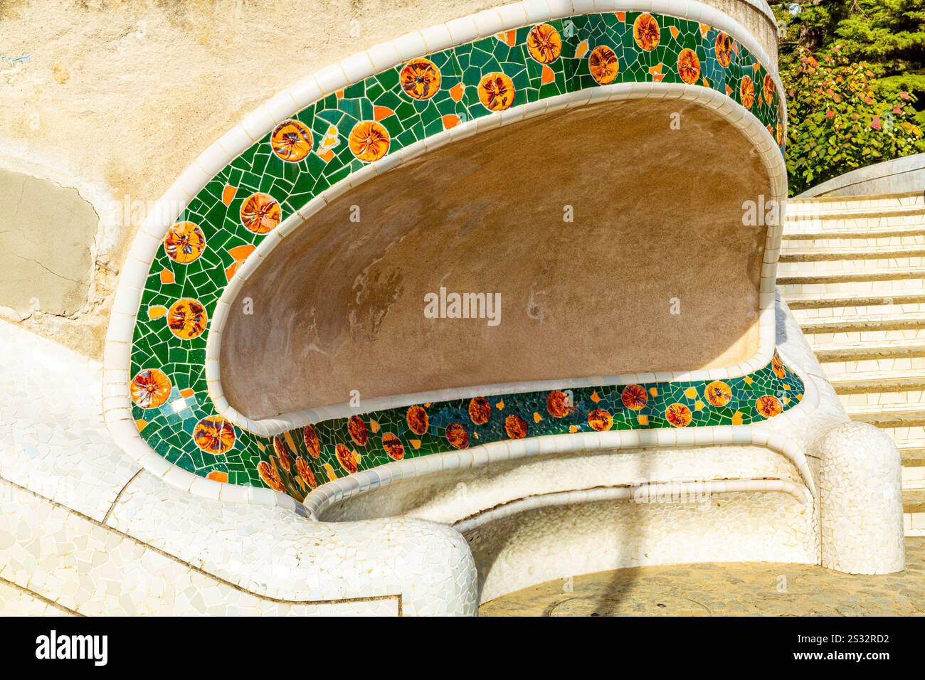 Oval structure between stairs with green tiles and yellow touches ...