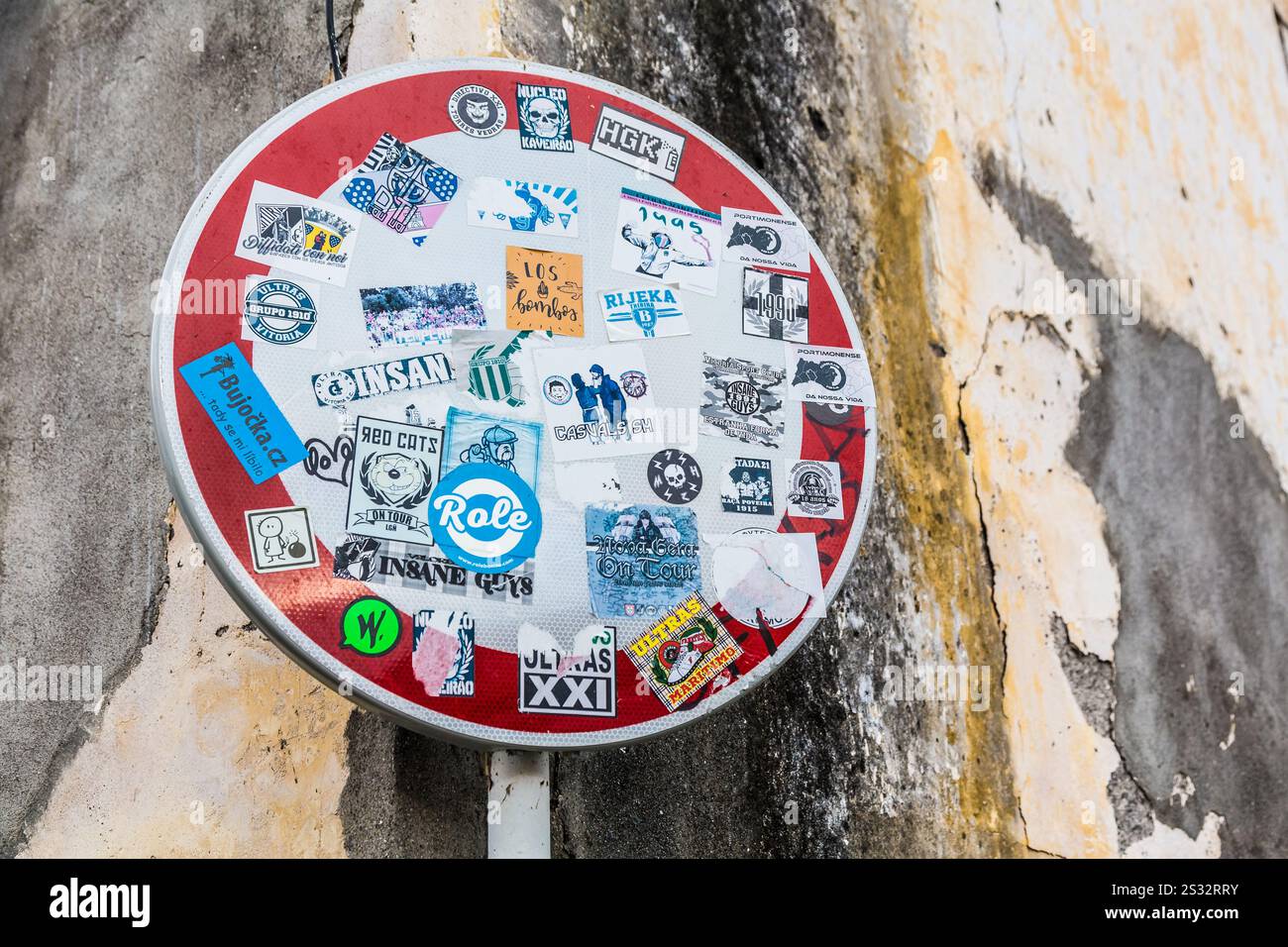 Road sign covered with stickers, Funchal, Madeira Stock Photo - Alamy