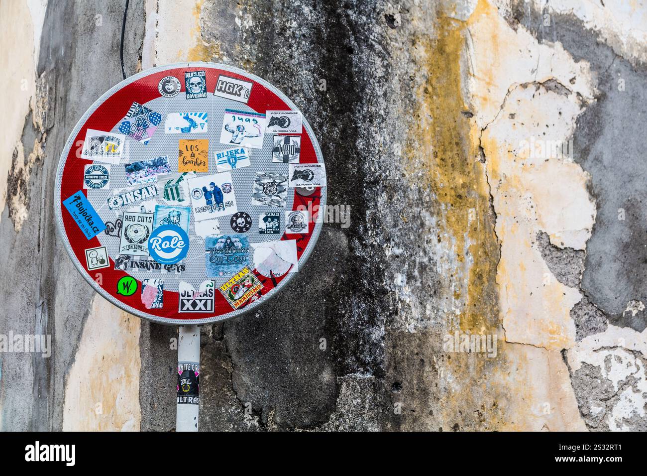 Road sign covered with stickers, Funchal, Madeira Stock Photo - Alamy