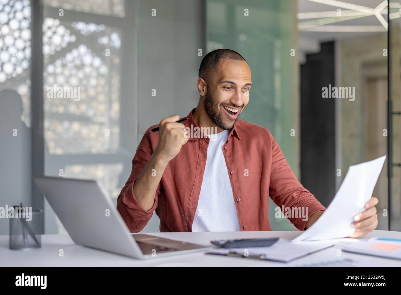 Successful financier celebrating victory and success reading report ...