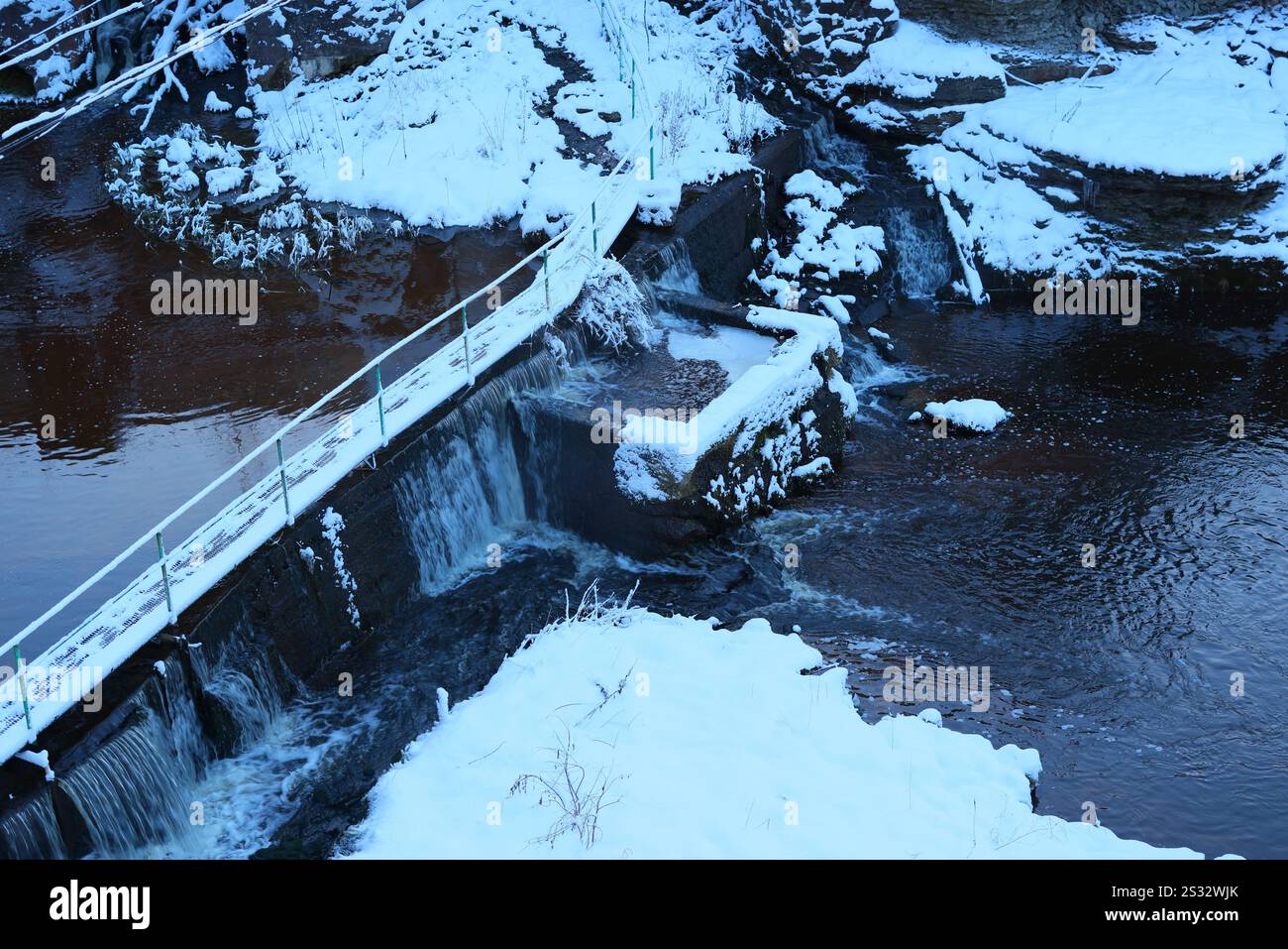The Snowy River Dam, surrounded by its frozen winter landscape, is a ...