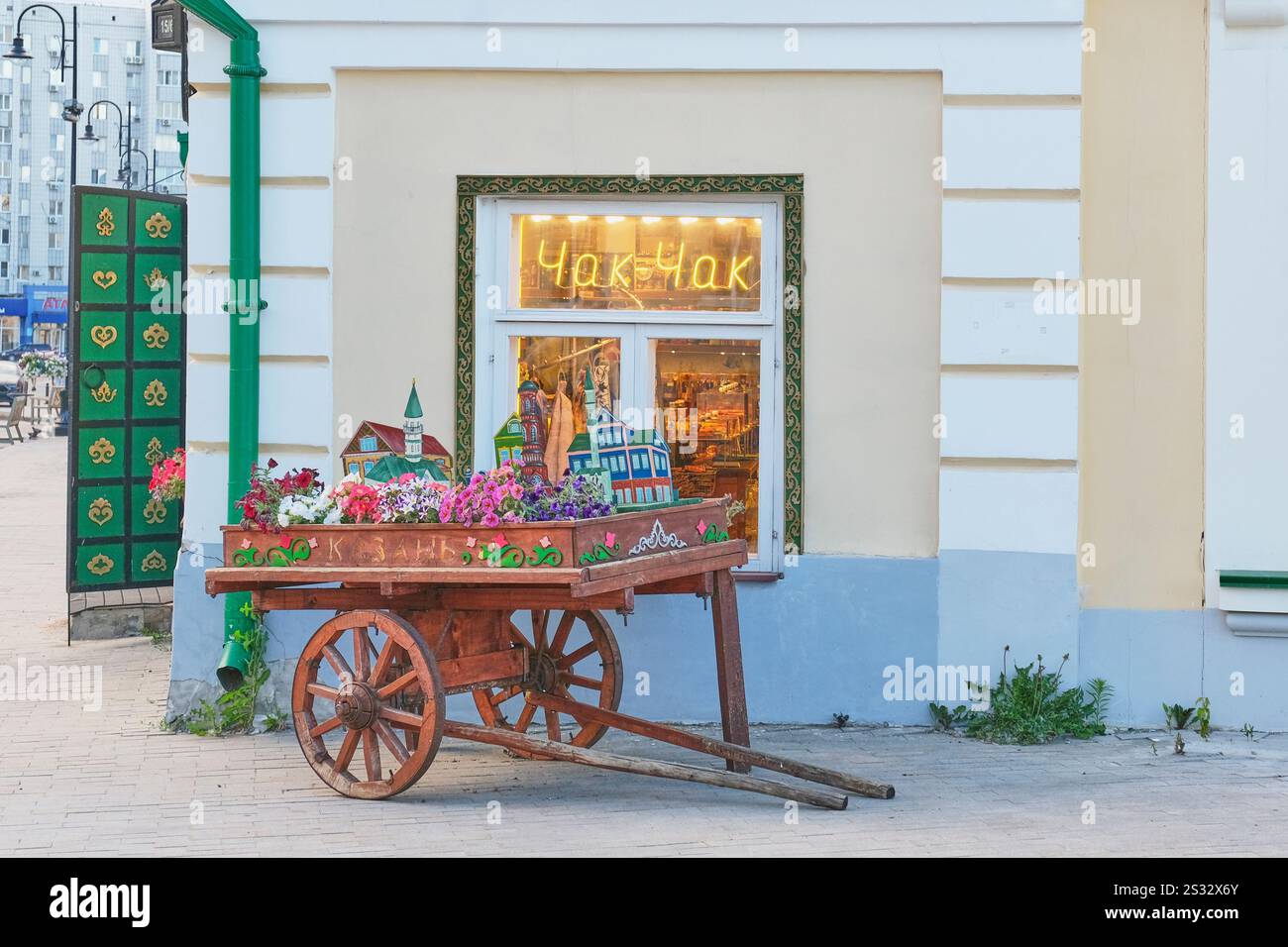 Kazan, Russia - June 12, 2024: Decorative wooden cart with flowers and ...