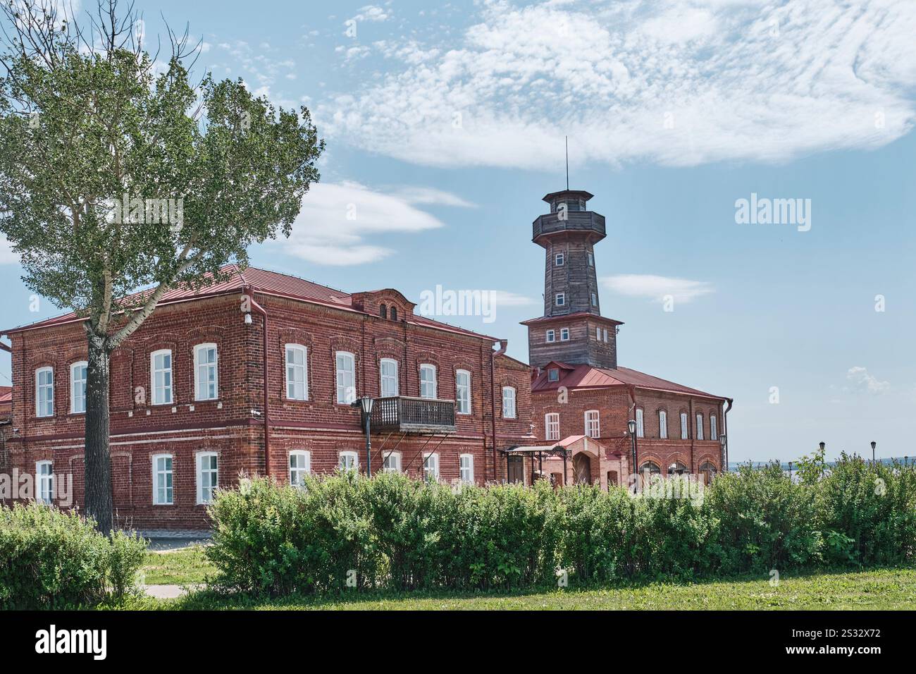 19th-century fire station from red brick, traditional wooden fire tower ...