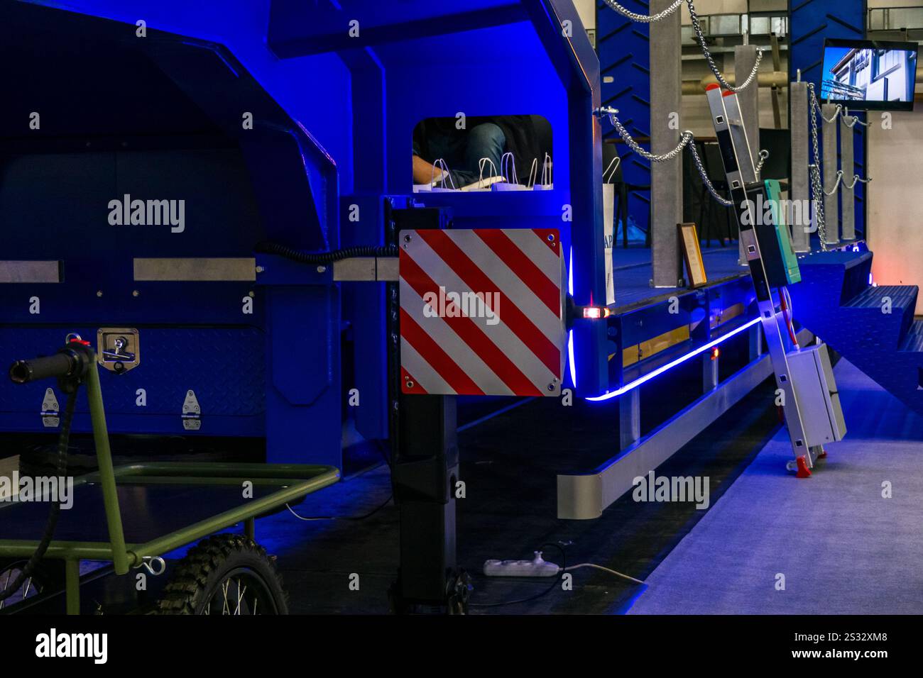 The rear of a large truck with a low-bed platform designed for ...
