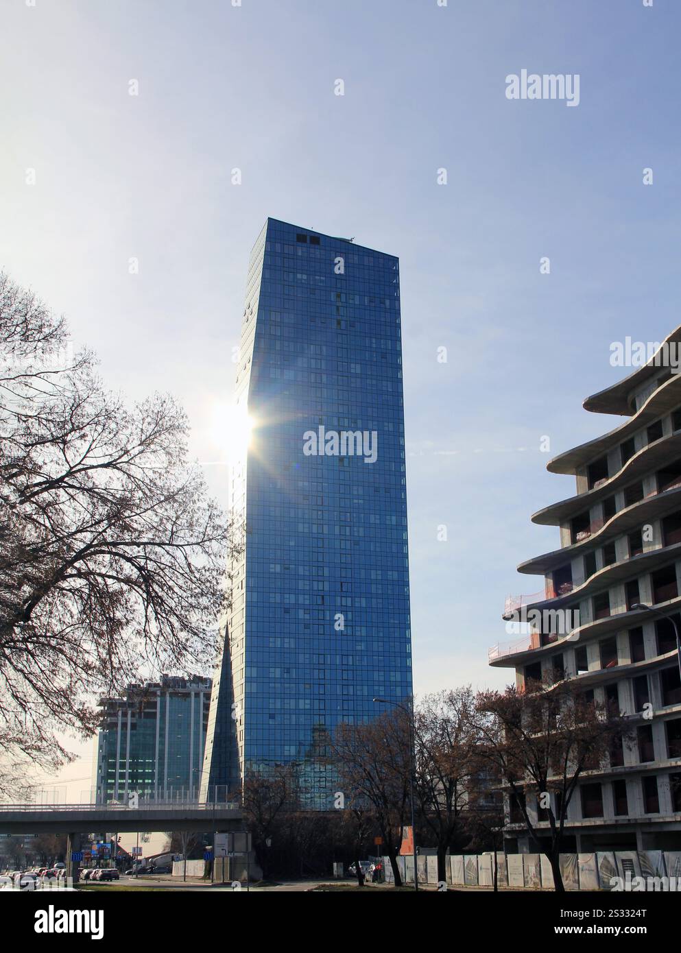 a contemporary building with a glass facade in New Belgrade. the ...