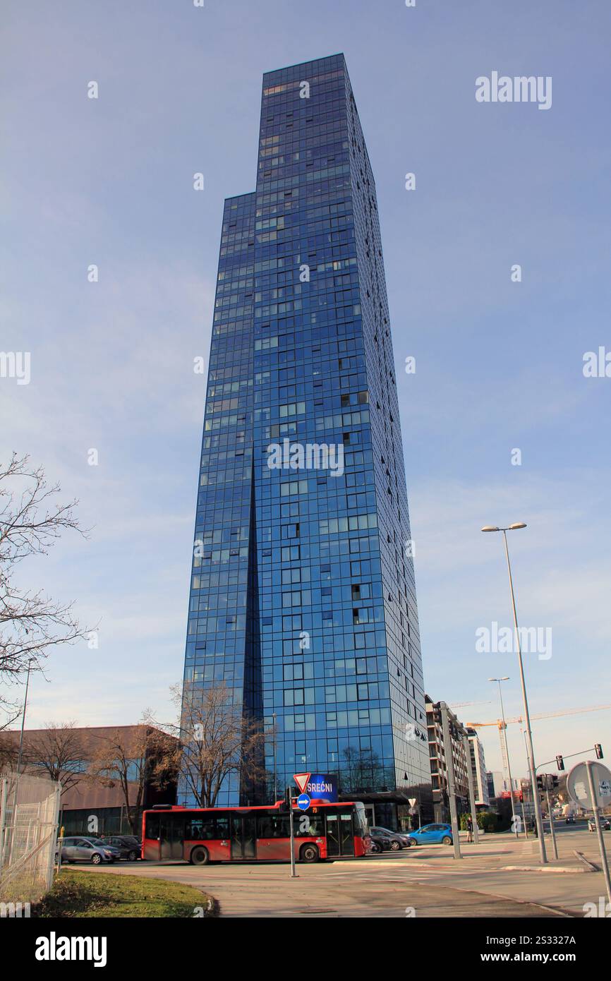 a contemporary building with a glass facade in New Belgrade. the ...