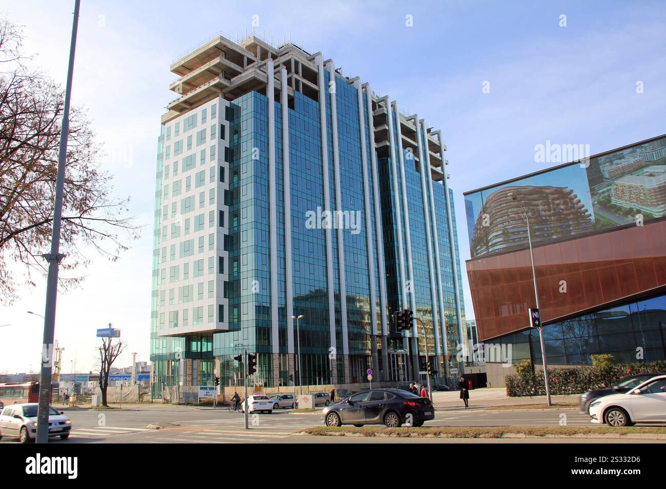 a contemporary building with a glass facade in New Belgrade. the ...