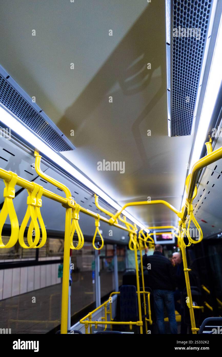 The interior of a modern public transport vehicle, featuring bright ...
