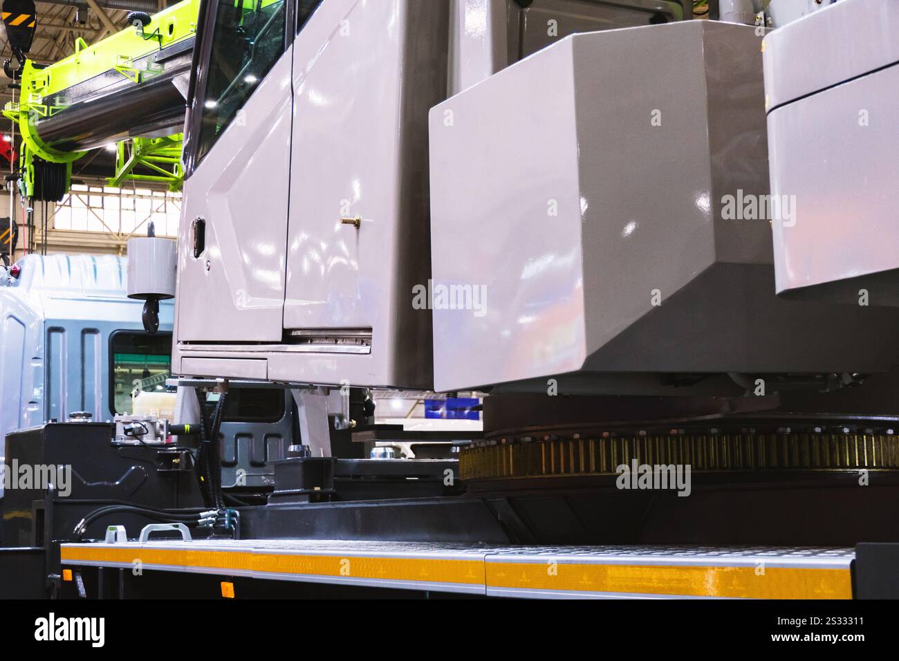 A close-up view of a mobile crane, focusing on the slewing ring and ...